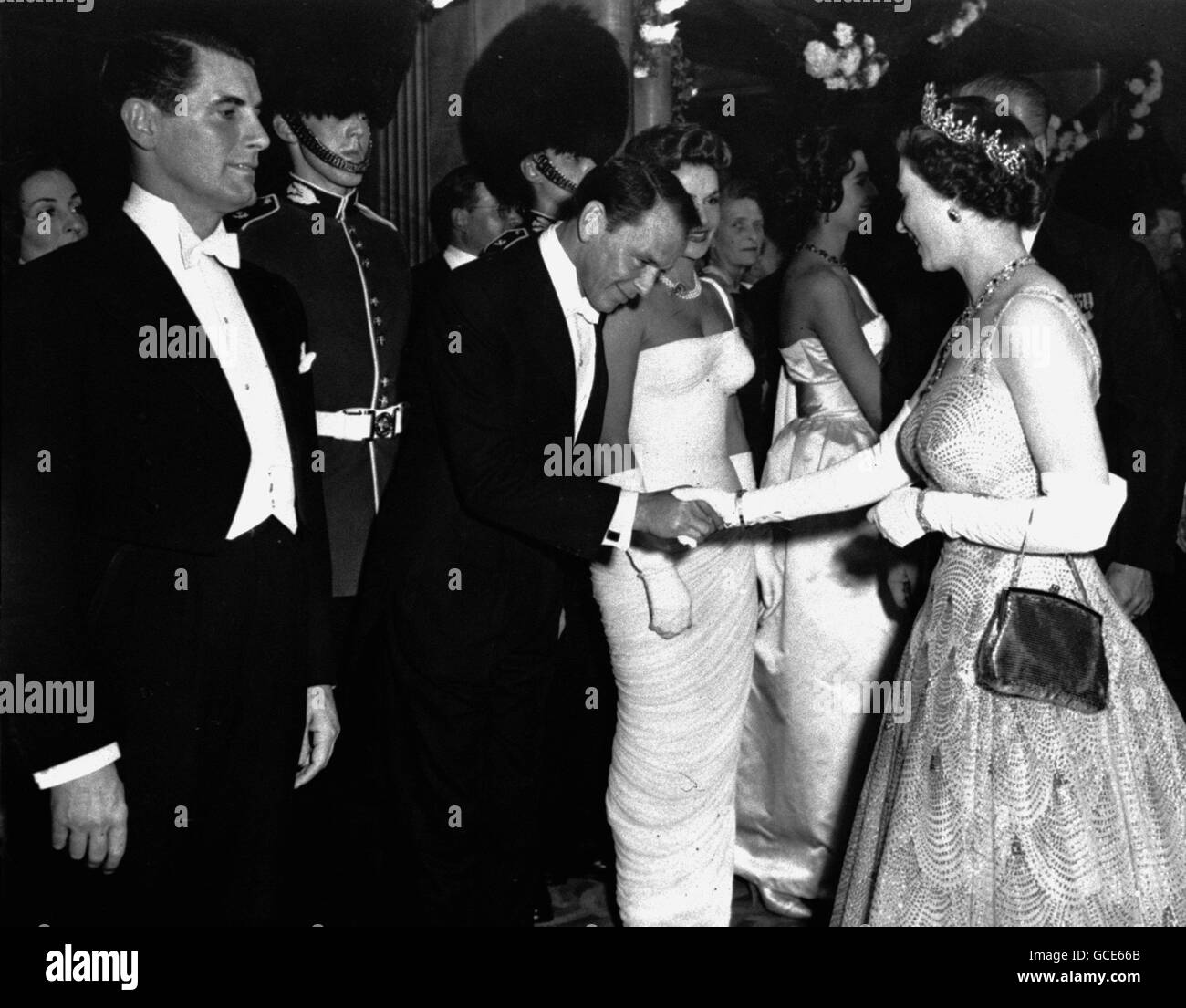 American singer and actor Frank Sinatra is presented to Queen Elizabeth ...