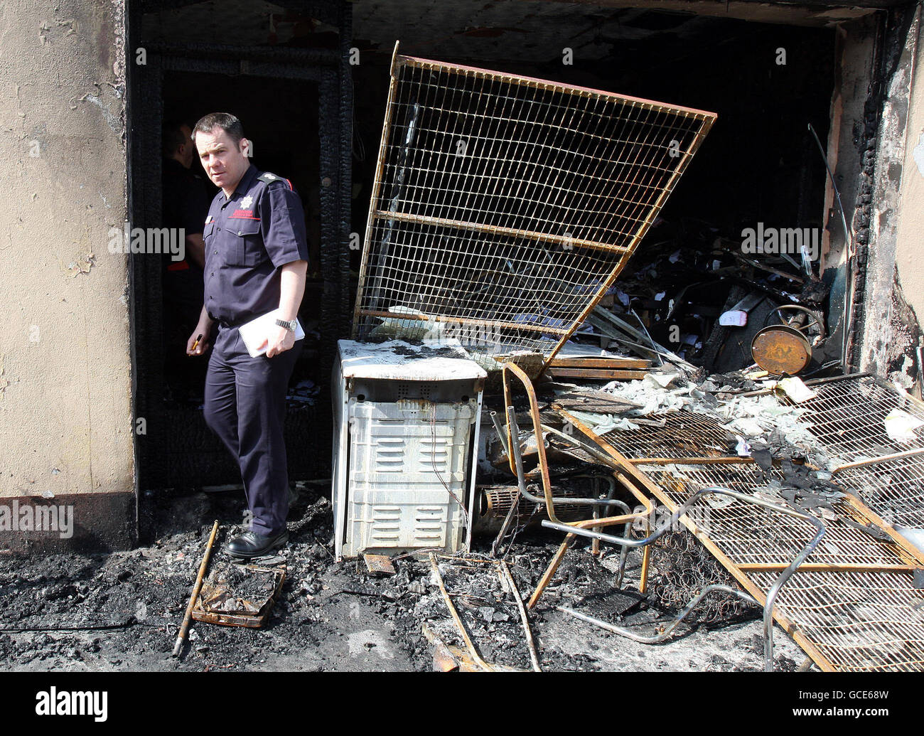 Fire officers at the scene of the fire in Newry Co Down following an ...