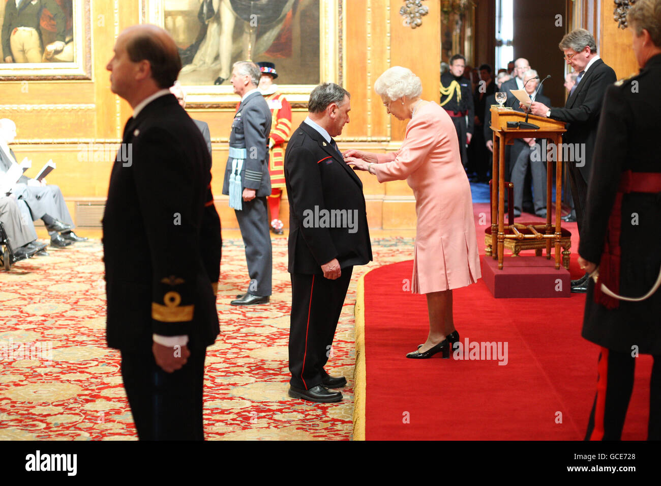 Mr. Peter Armitage is made an MBE by The Queen at Windsor Castle Stock ...