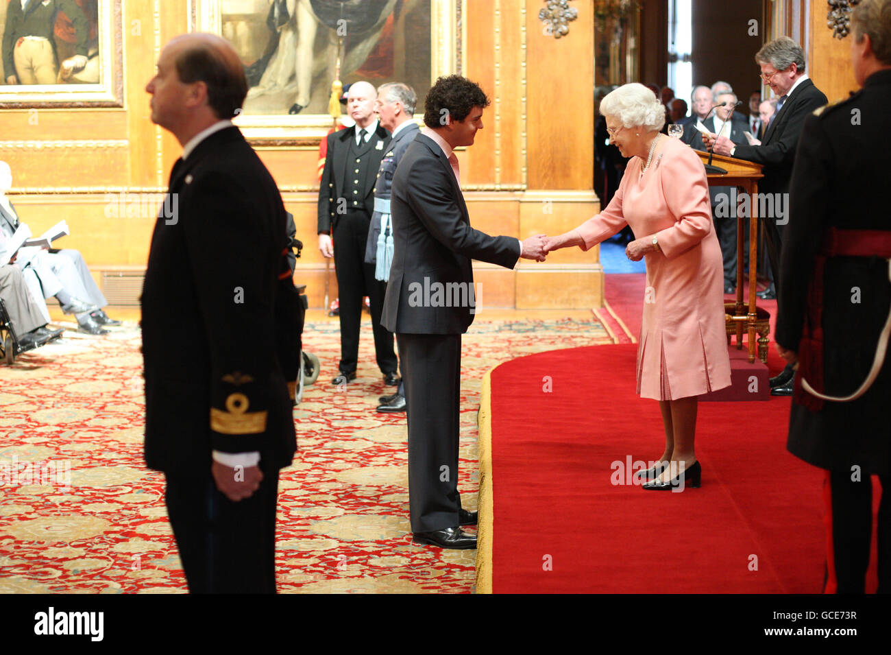 Mr. Christopher Kealey is made an MBE by The Queen at Windsor Castle ...