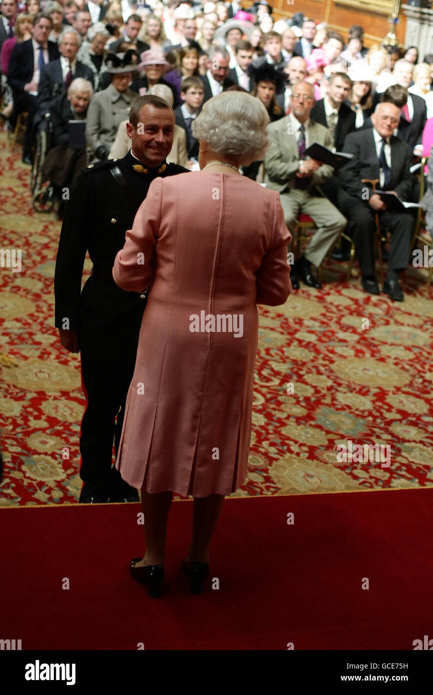 Major Jonathan Scott, Royal Engineers, is made an MBE by The Queen at ...