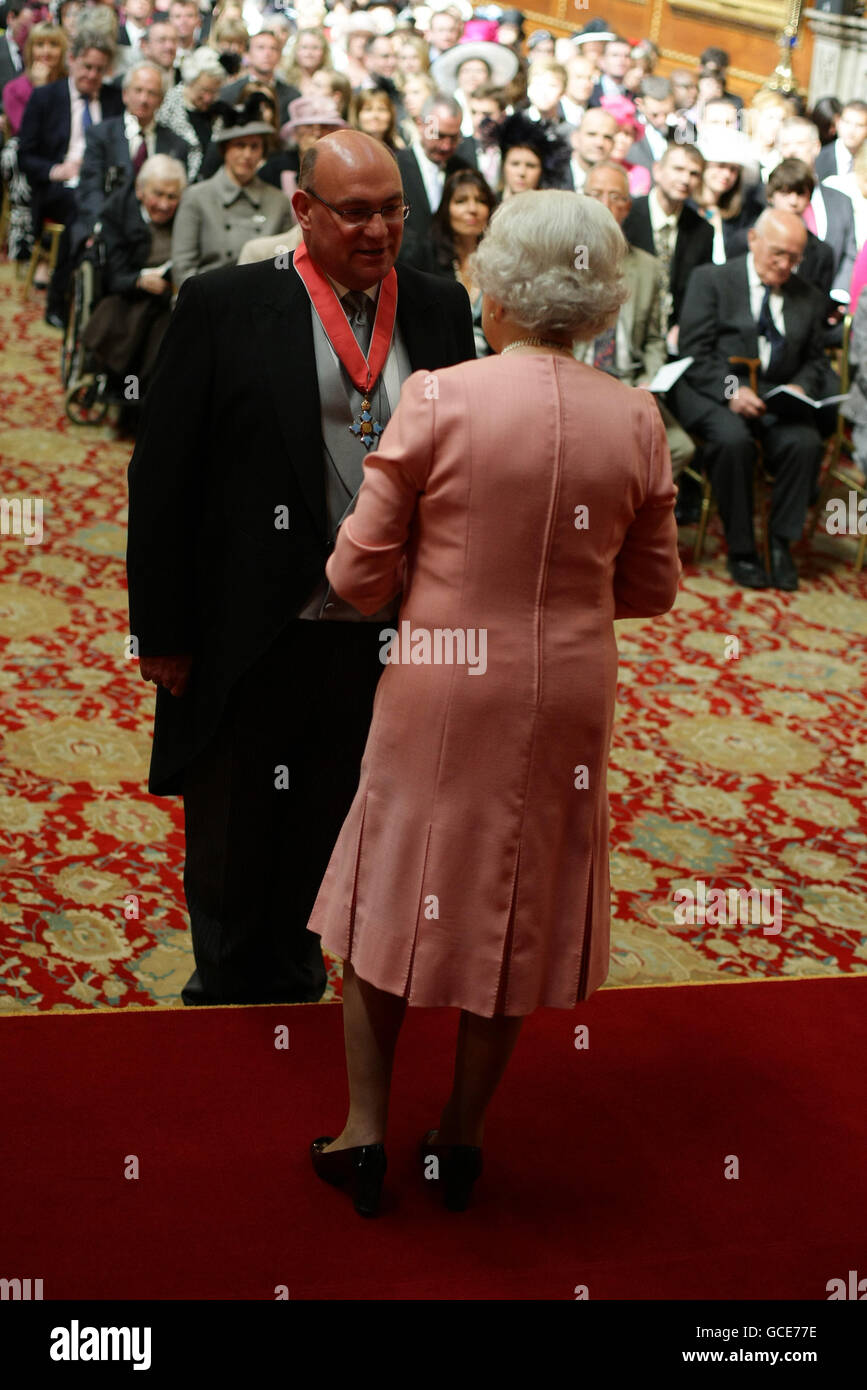 Mr. Paul Leighton is made a CBE by The Queen at Windsor Castle Stock ...