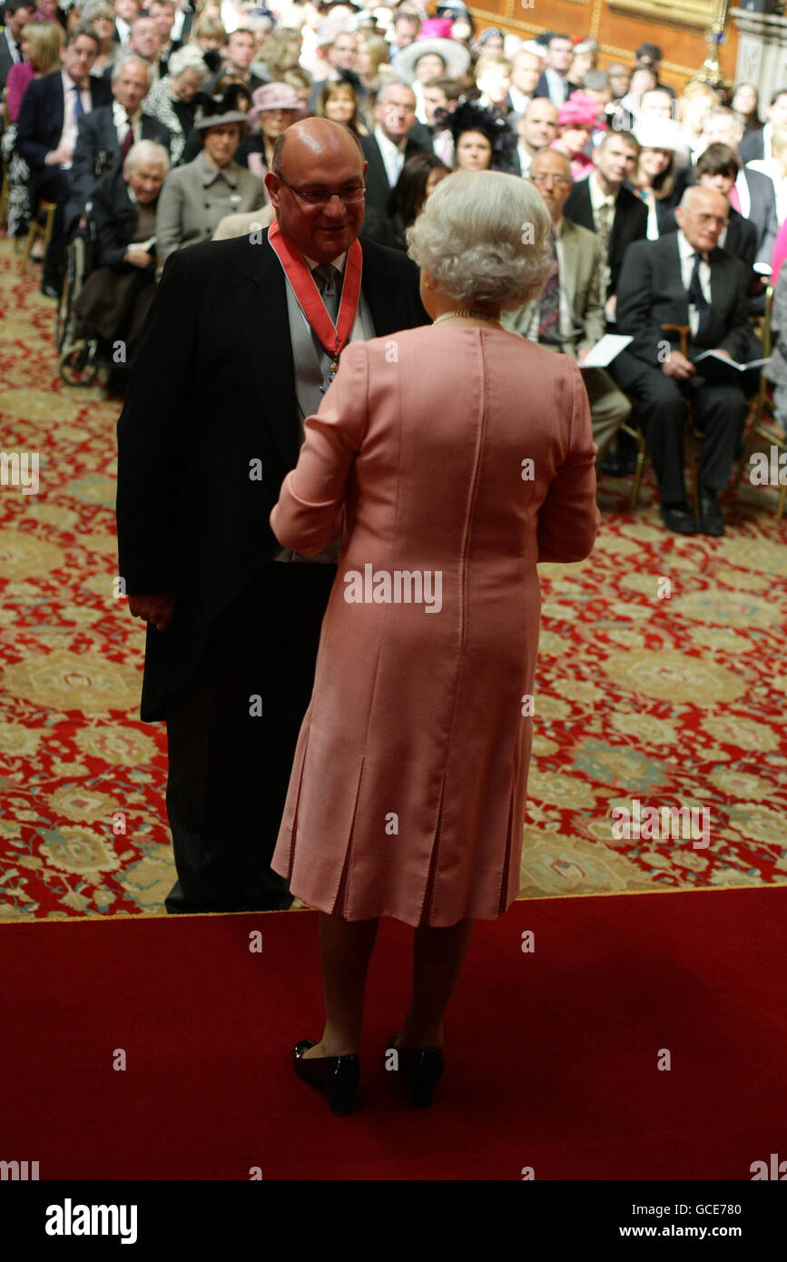 Mr. Paul Leighton is made a CBE by The Queen at Windsor Castle Stock ...