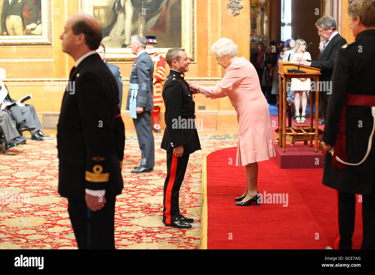 Major Jonathan Scott, Royal Engineers, is made an MBE by The Queen at ...
