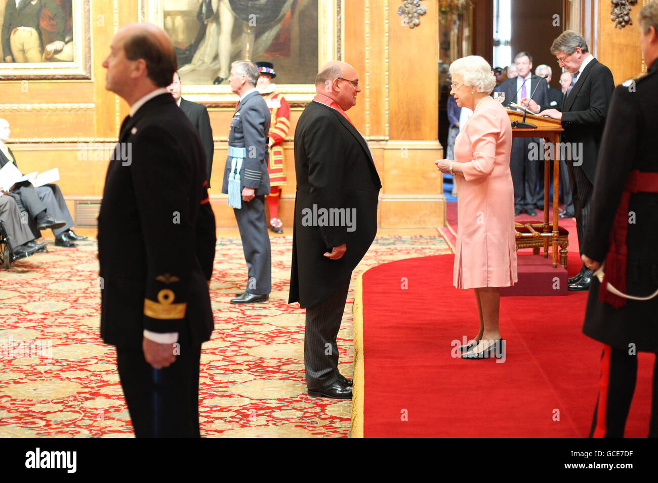 Mr. Paul Leighton is made a CBE by The Queen at Windsor Castle Stock ...