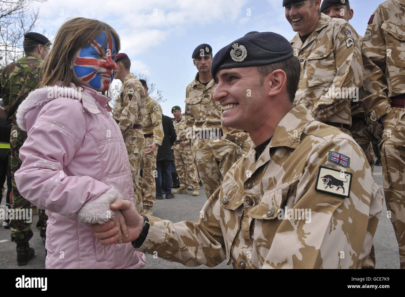 Leah Field, 7, meets Sapper Gary Anders, 26, after a march through the ...