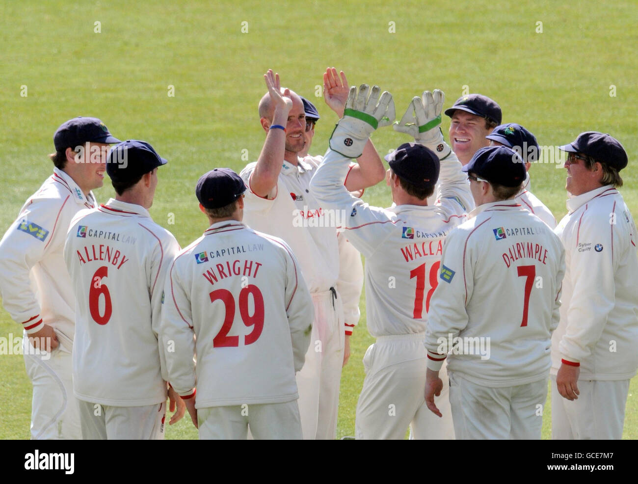 Glamorgan's David Harrison (centre) celebrates taking his fifth wicket ...