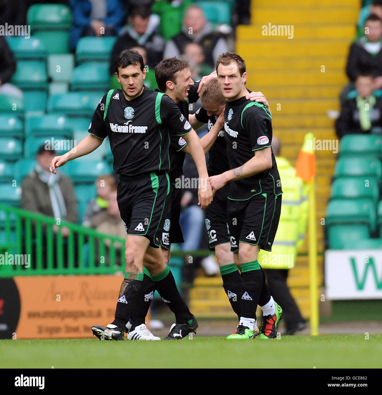 Hibernian's Derek Riordan (second right) celebrates with team mates ...
