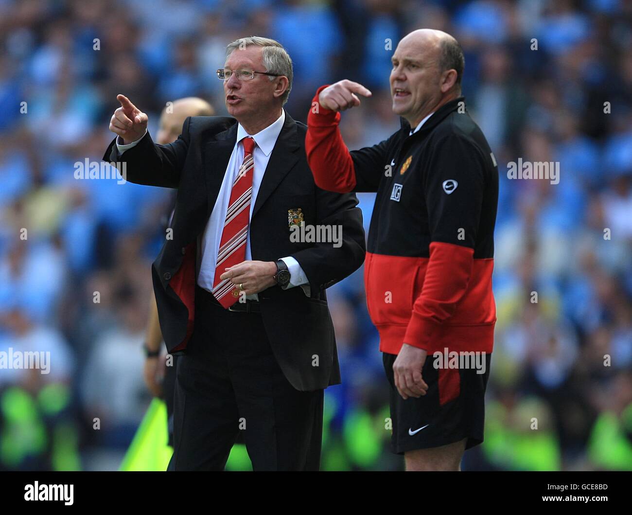 Manchester United manager Alex Ferguson (left) and assistant manager ...