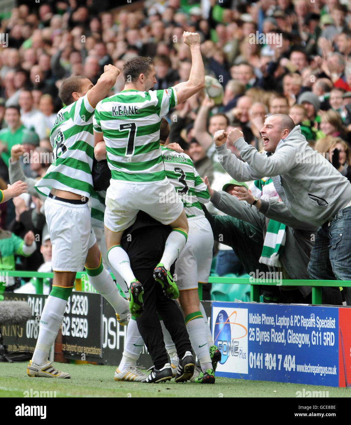Cetic's Morten Rasmussen (obscured) celebrates with teammates in front ...