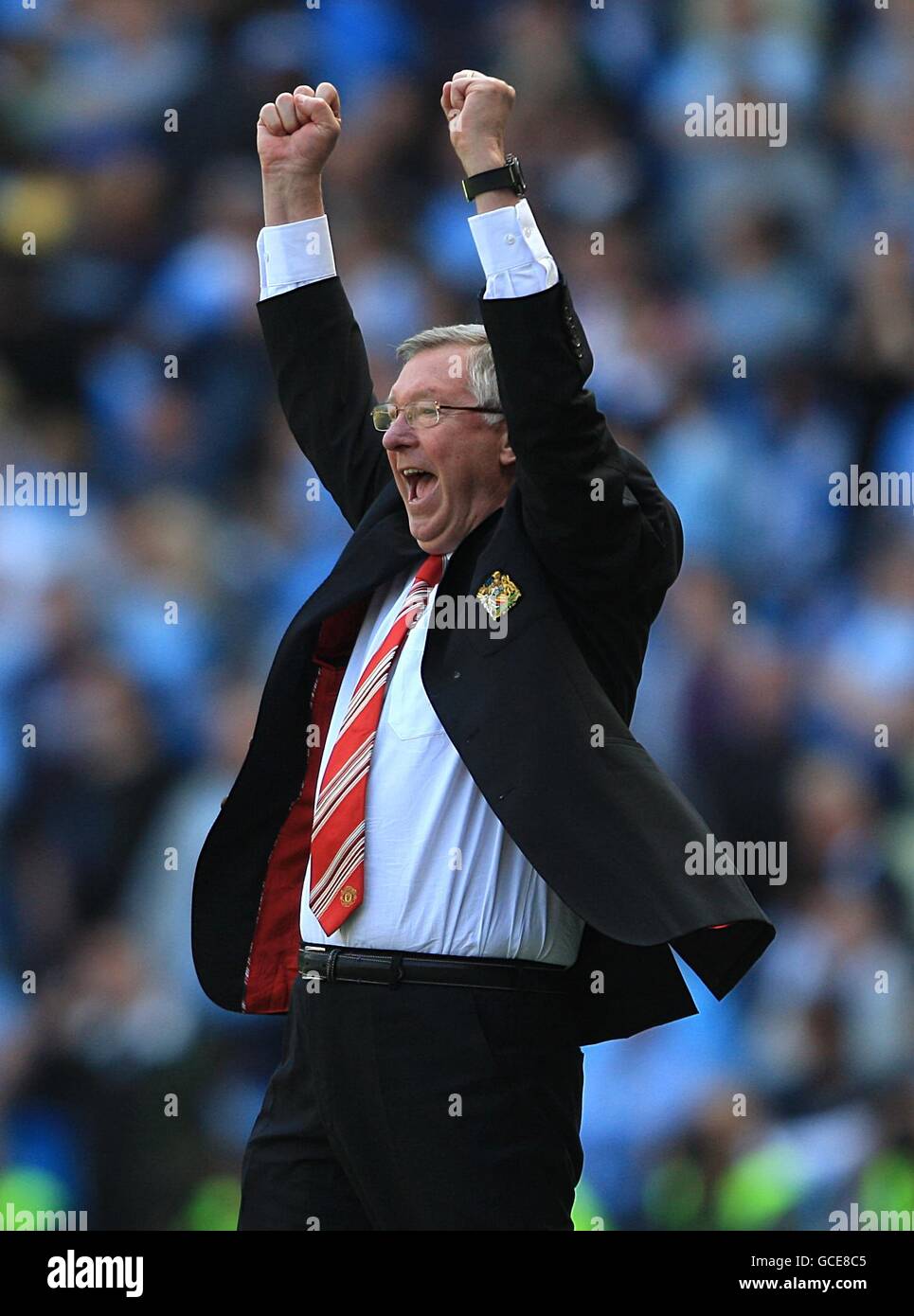 Manchester United manager Alex Ferguson celebrates on the touchline ...