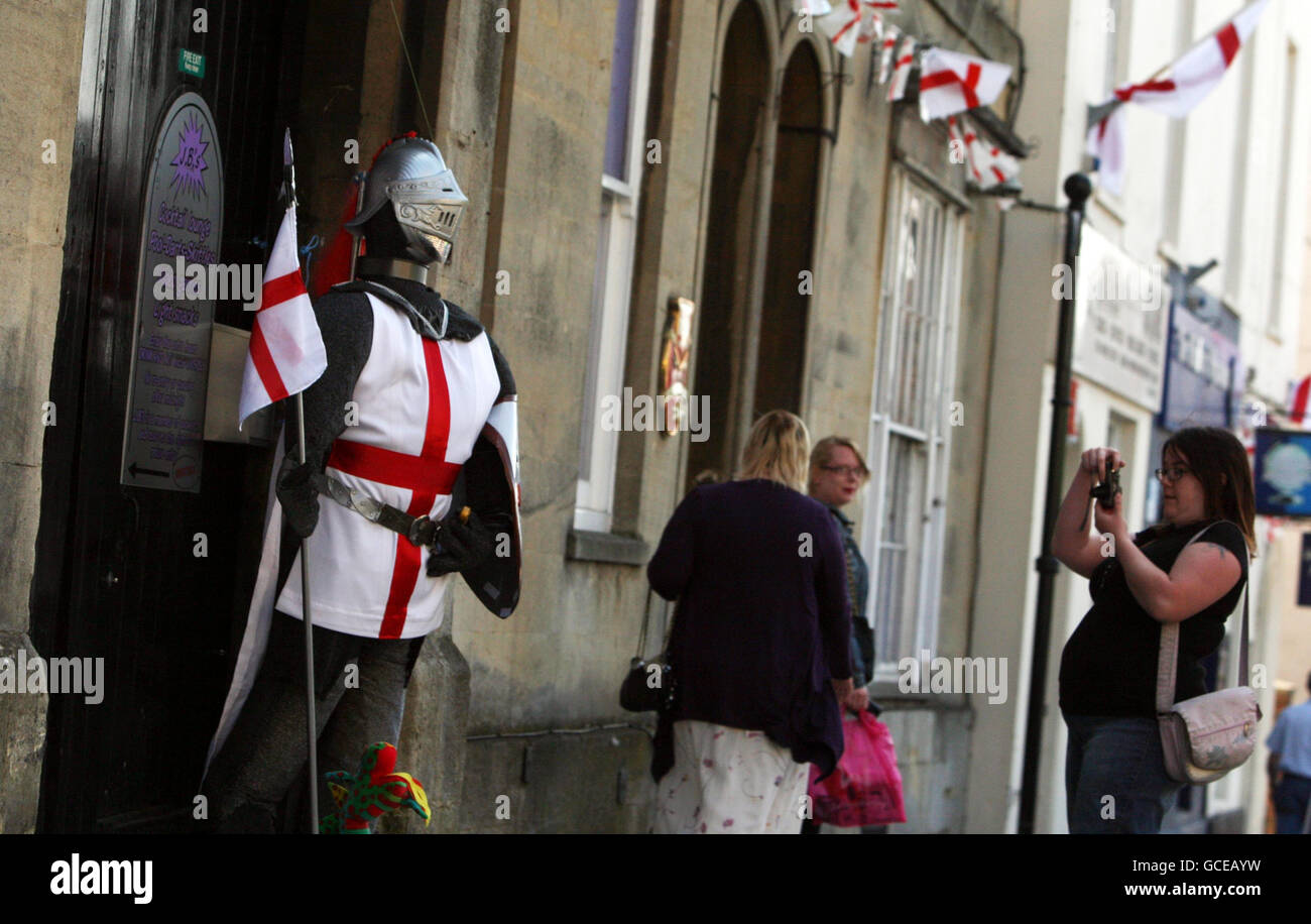 A woman takes a photograph of a mannequin dressed as St George, the ...