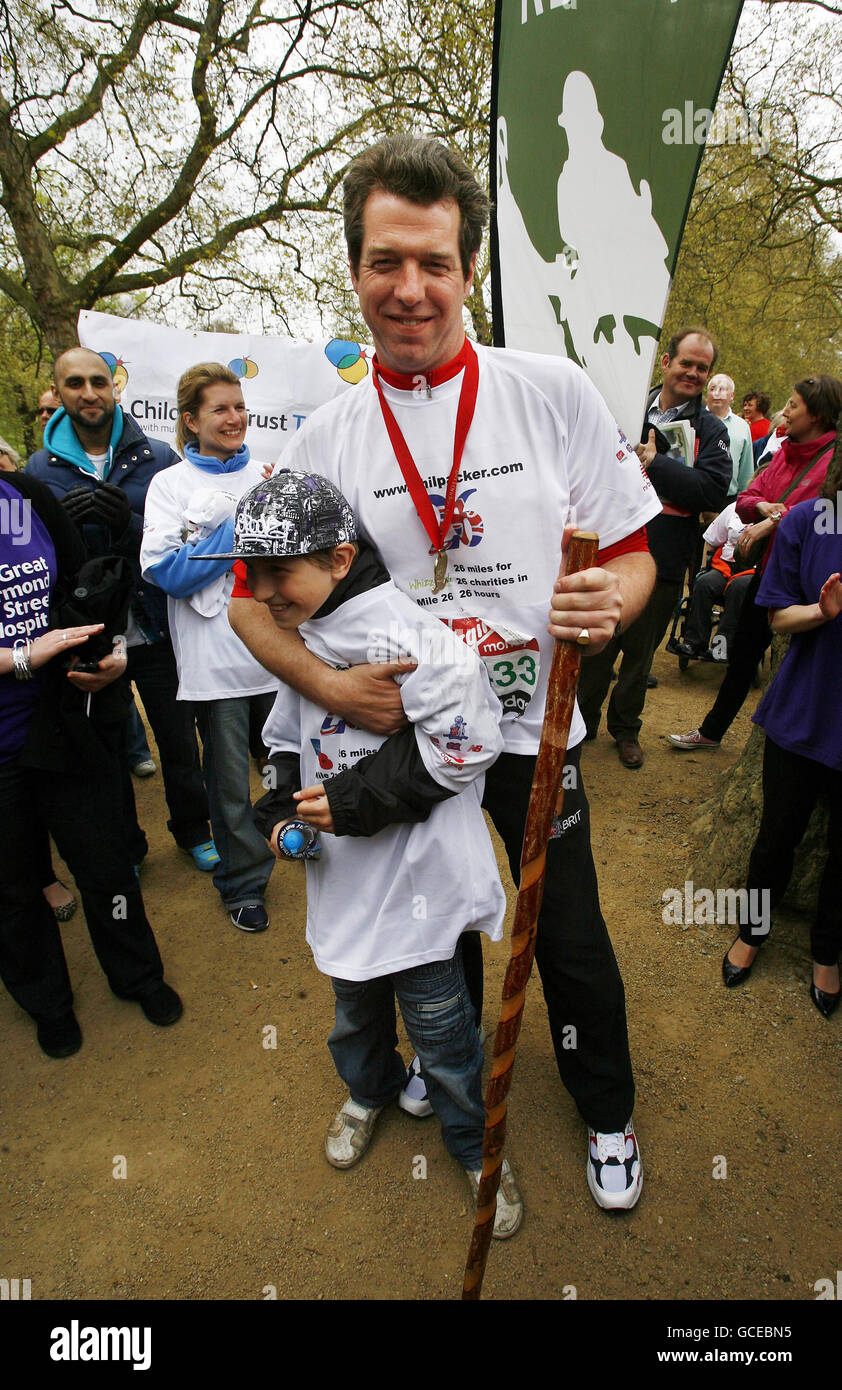 Major Phil Packer (centre), who suffered a spinal cord injury serving ...