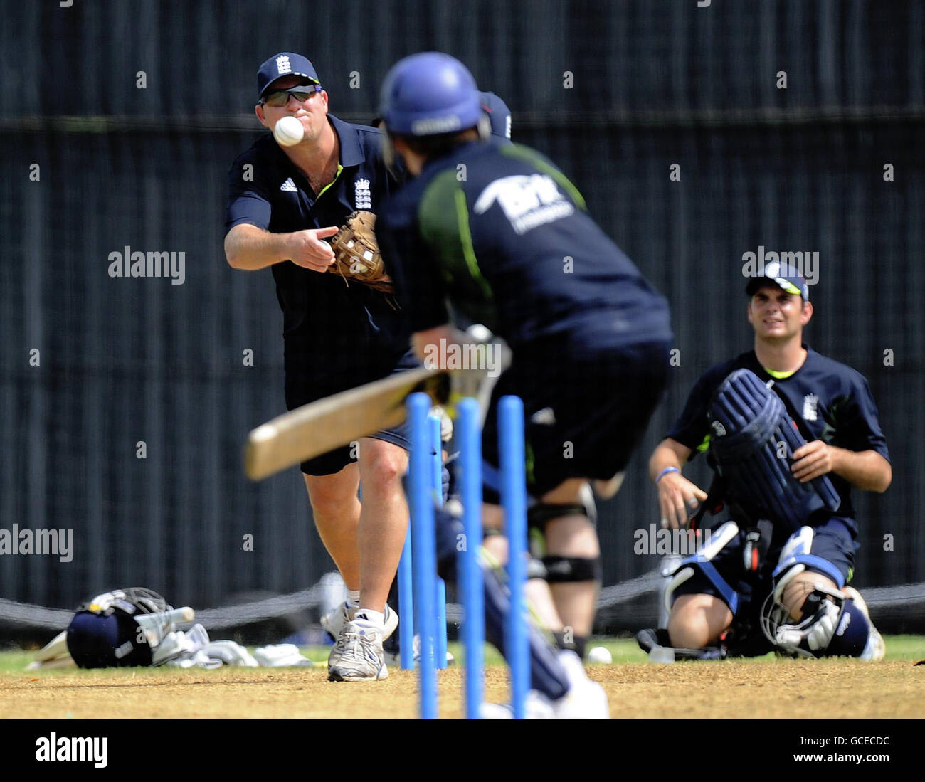England's fast bowling coach David Saker (left) during the practice ...