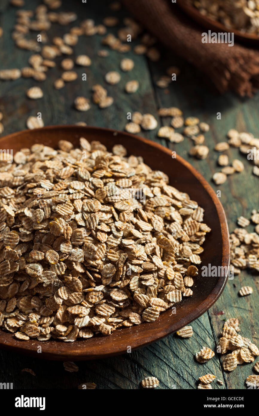 Organic Rolled Rye Flakes in a Bowl Stock Photo - Alamy