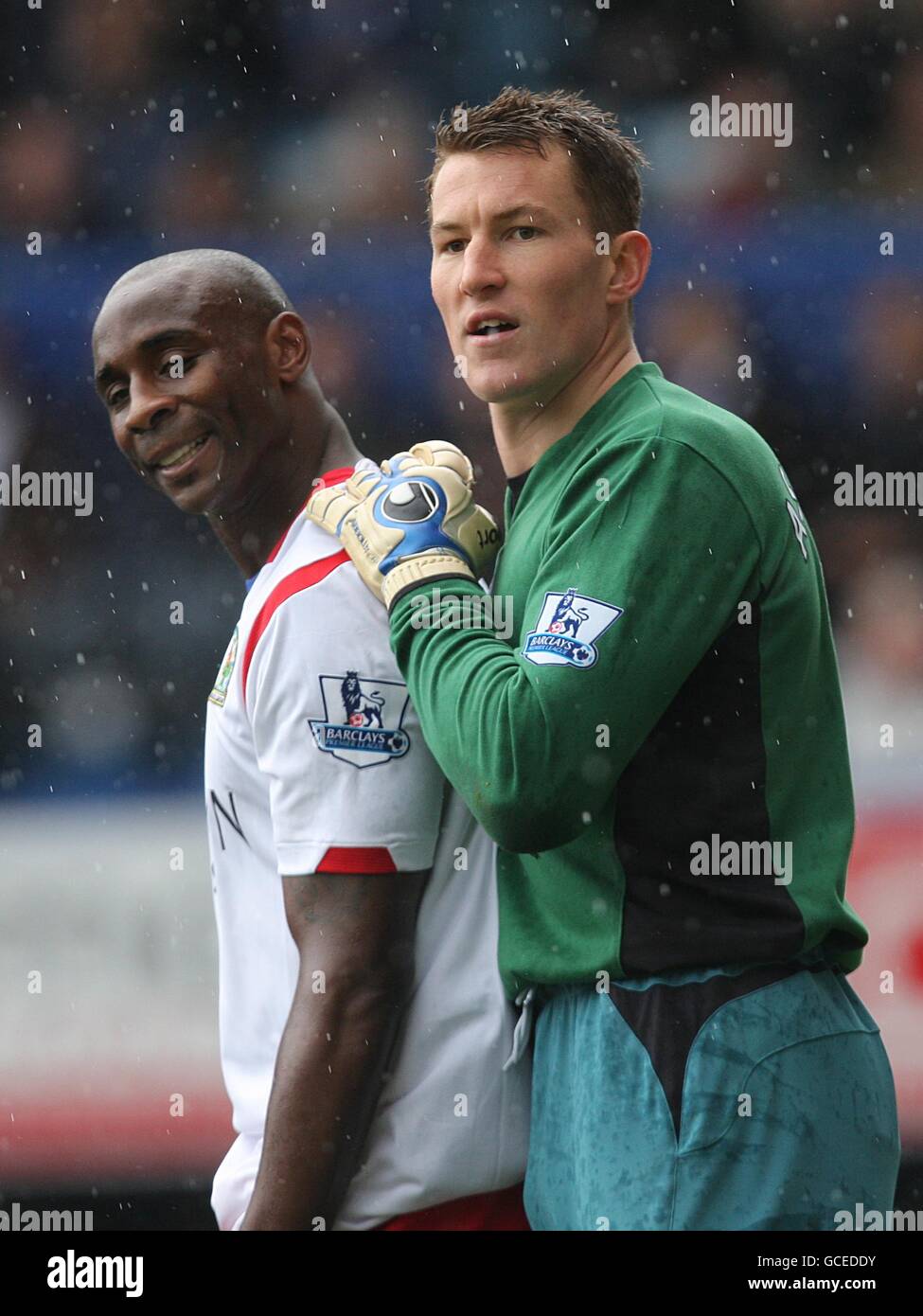 Blackburn Rovers' Jason Roberts (left) with Portsmouth goalkeeper Jamie ...