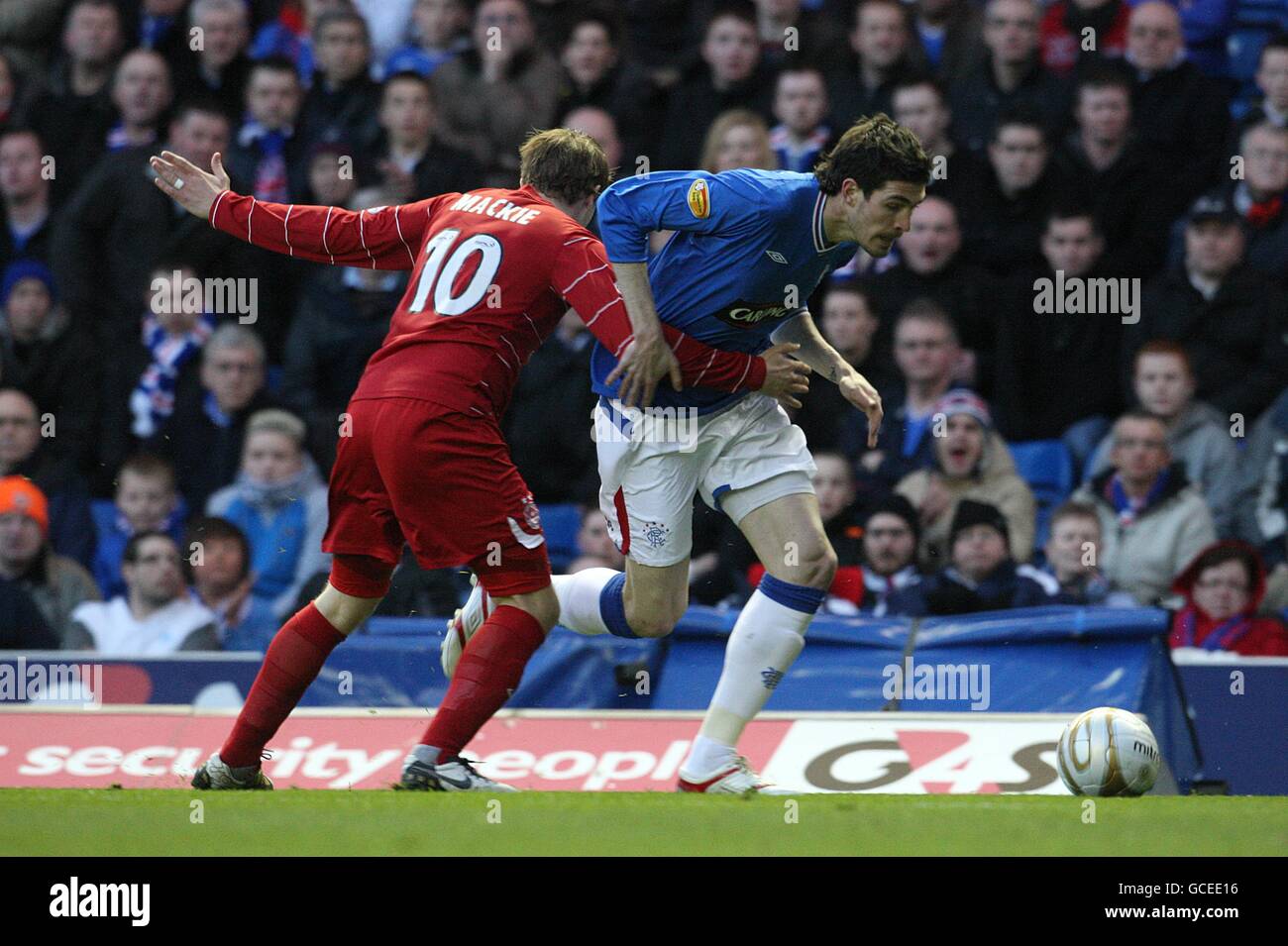 Aberdeens mackie left rangers kyle lafferty battle for the ball hi-res ...