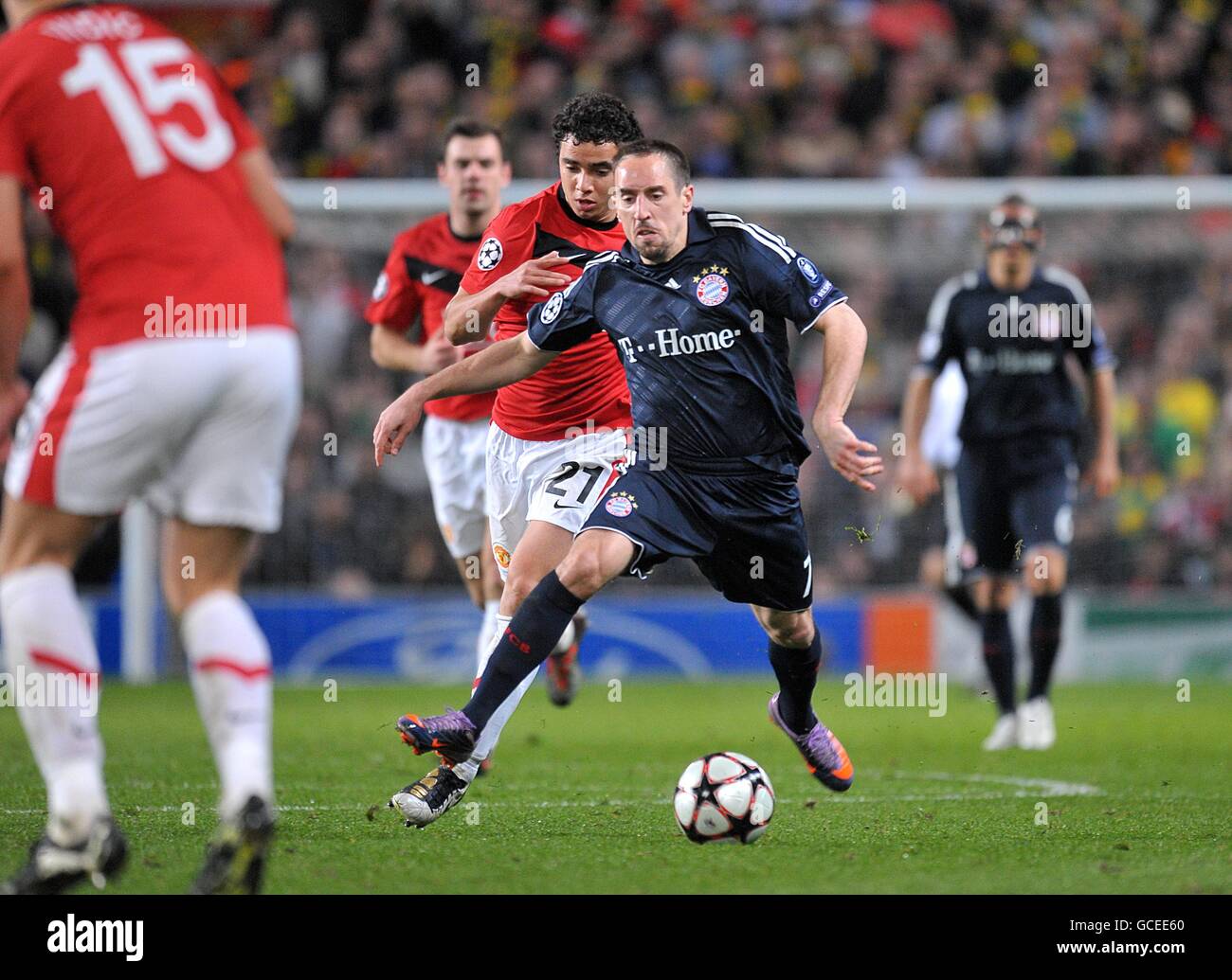 Manchester United's Rafael Da Silva (left) fouls Bayern Munich's Franck ...