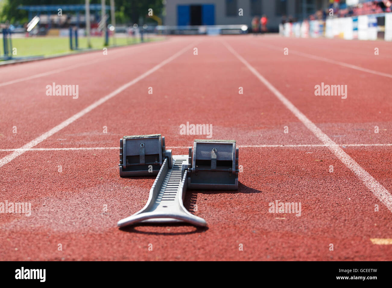 Athletic track. Athletics starting blocks (Shallow DOF Stock Photo - Alamy