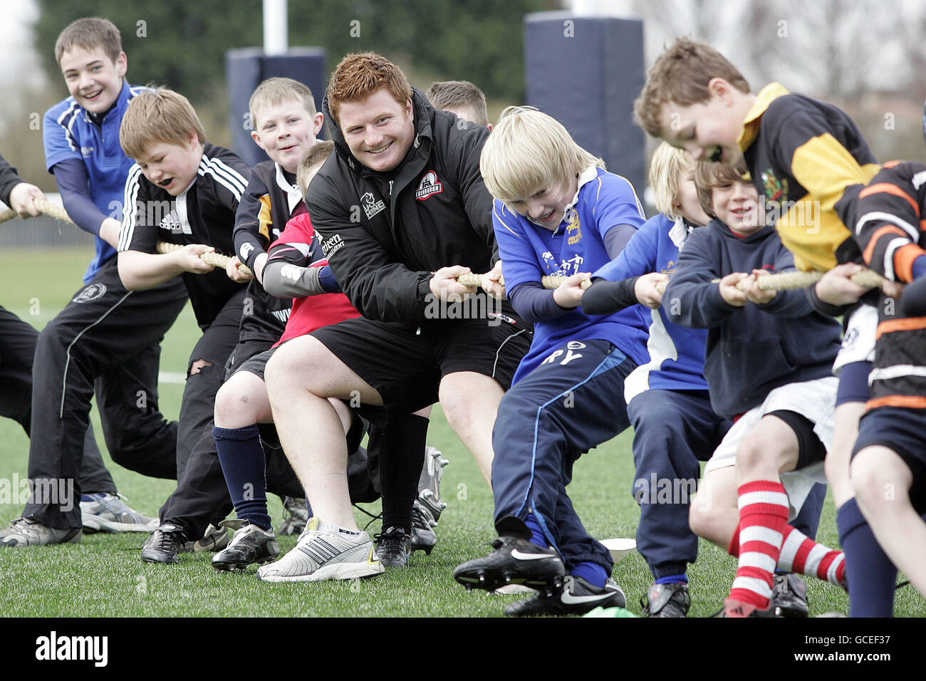 Edinburgh's Kyle Traynor (centre) takes part in a tug of war during the ...