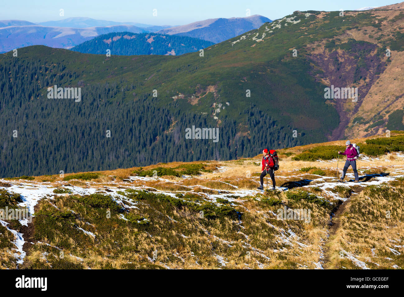 Two Hikers walking along Mountain ridge Stock Photo - Alamy