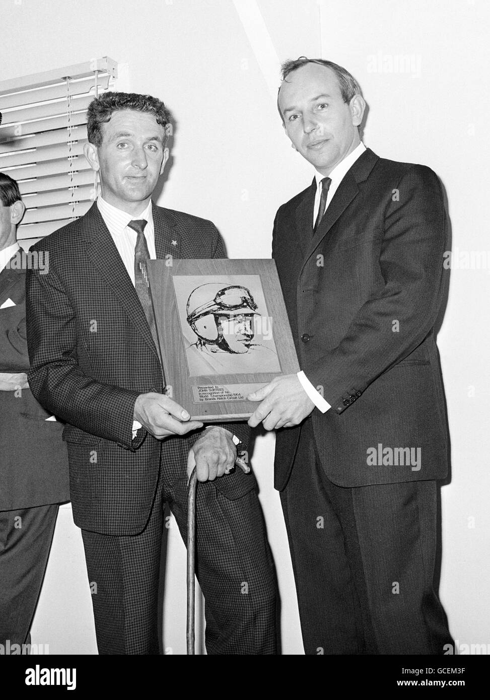 John Surtees, right, the World Champion car racing driver, receiving a ...