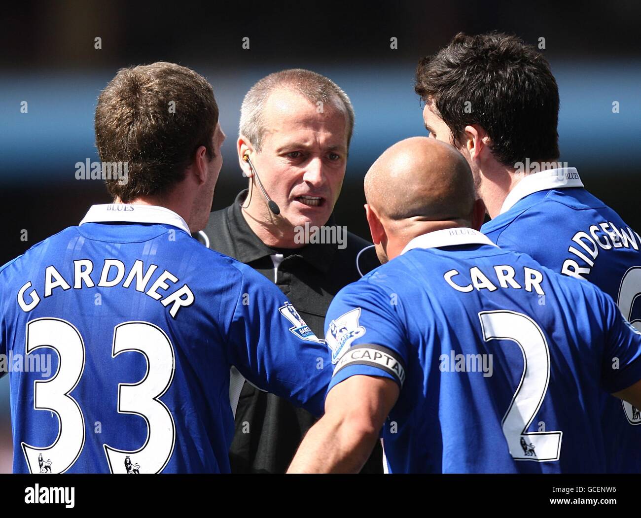 Referee Martin Atkinson (2nd left) is confronted by Birmingham City's ...