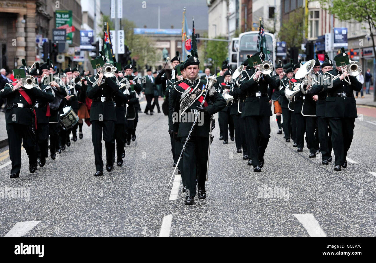 A military band parade during a re-dedication service for soldiers ...