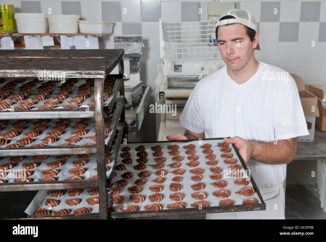 Man baking cookies in a manufactory Stock Photo - Alamy