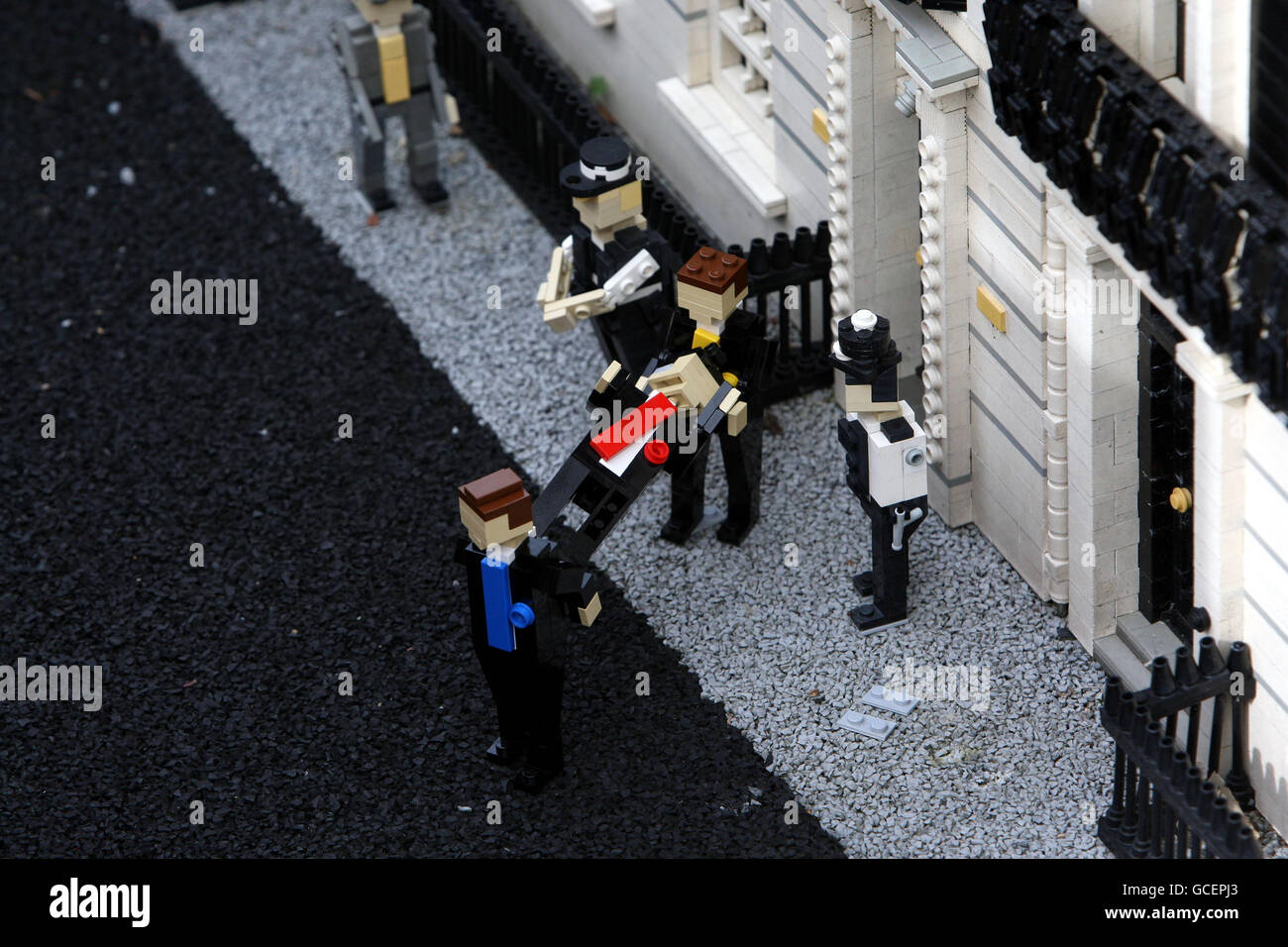 Mini lego figures of Nick Clegg and David Cameron carrying Gordon Brown ...