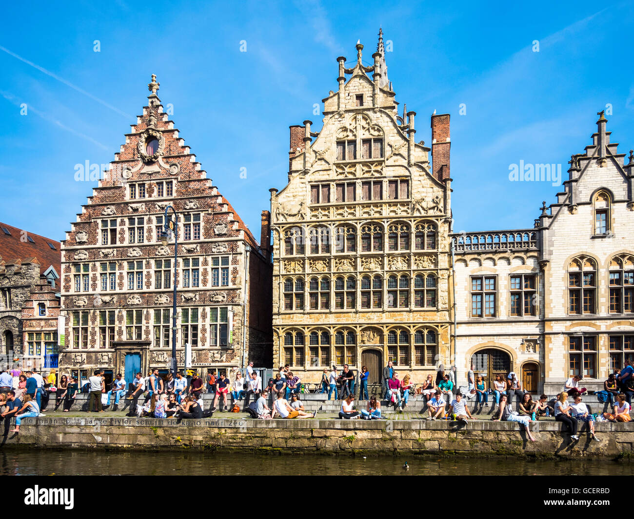 Leie River and promenade on the Graslei with old guild houses, young ...