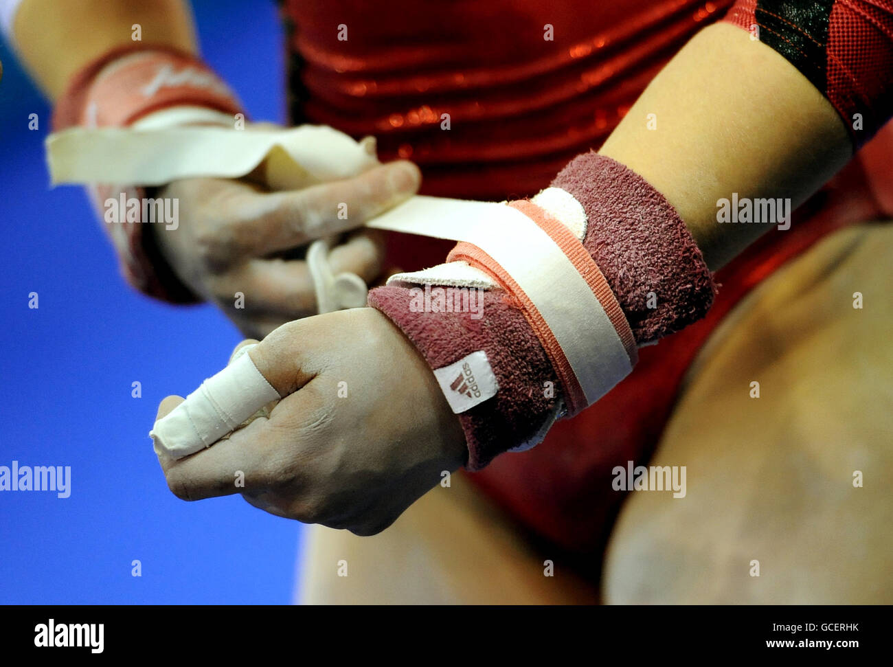 German's Janine Berger prepares to compete on the asymmetric bars ...