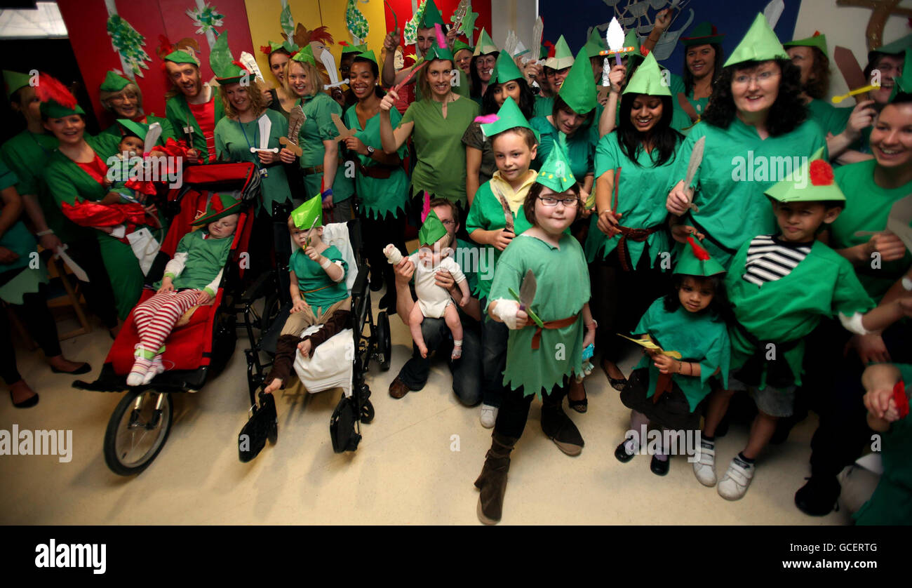 Children dressed as Peter Pan, with helpers and staff, at Great Ormond ...