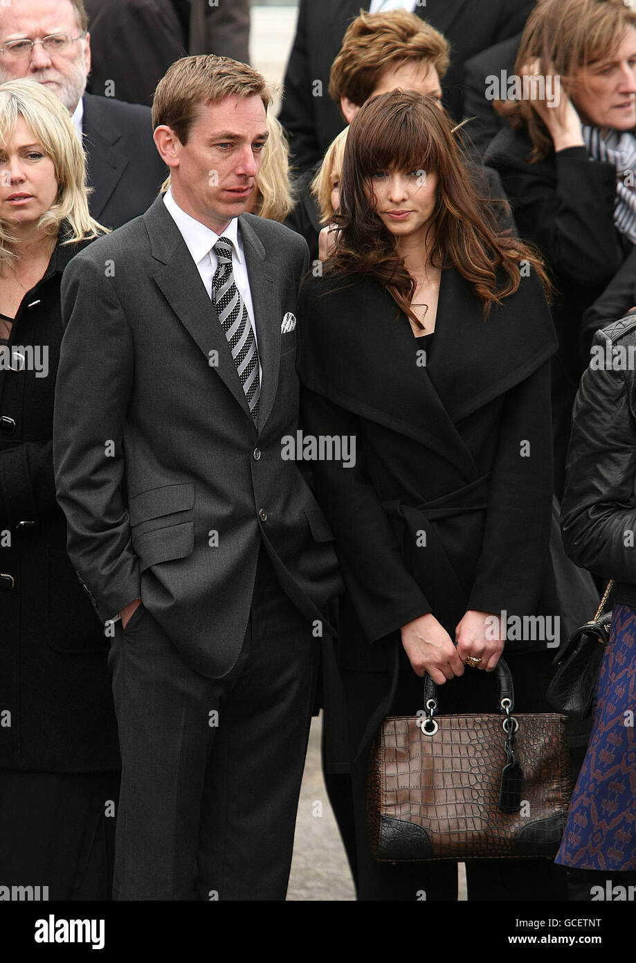 Presenter Ryan Tubridy stands with his partner Aoibhinn Ni ...