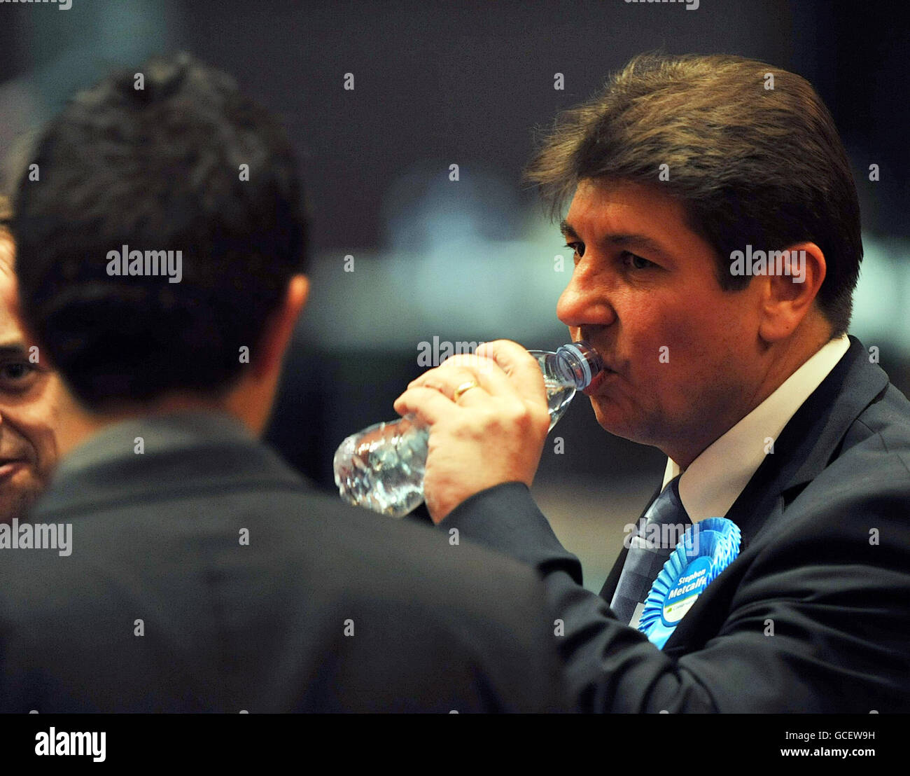 Conservative Stephen Metcalfe (right), drinks from a bottle during the ...