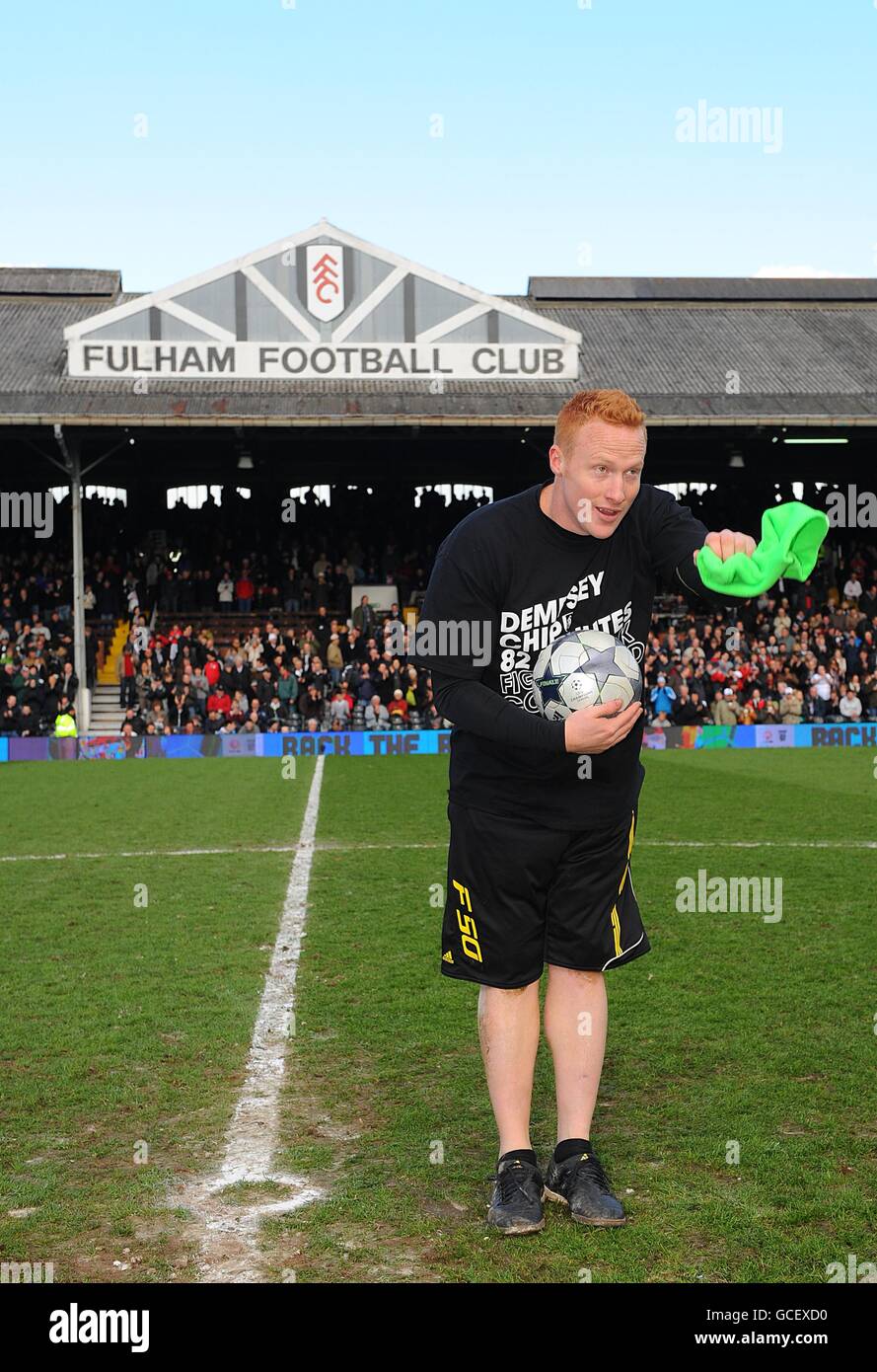 Football freestyler Dan Magness shows off his skills during half time ...