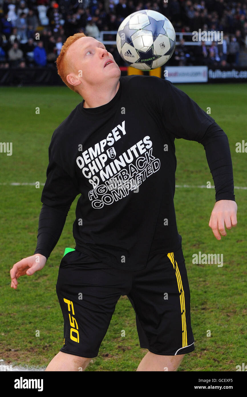 Football freestyler Dan Magness shows off his skills during half time ...