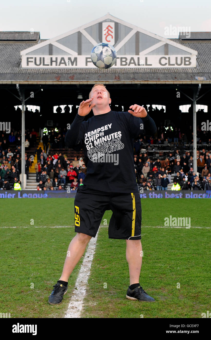 Football freestyler Dan Magness shows off his skills during half time ...