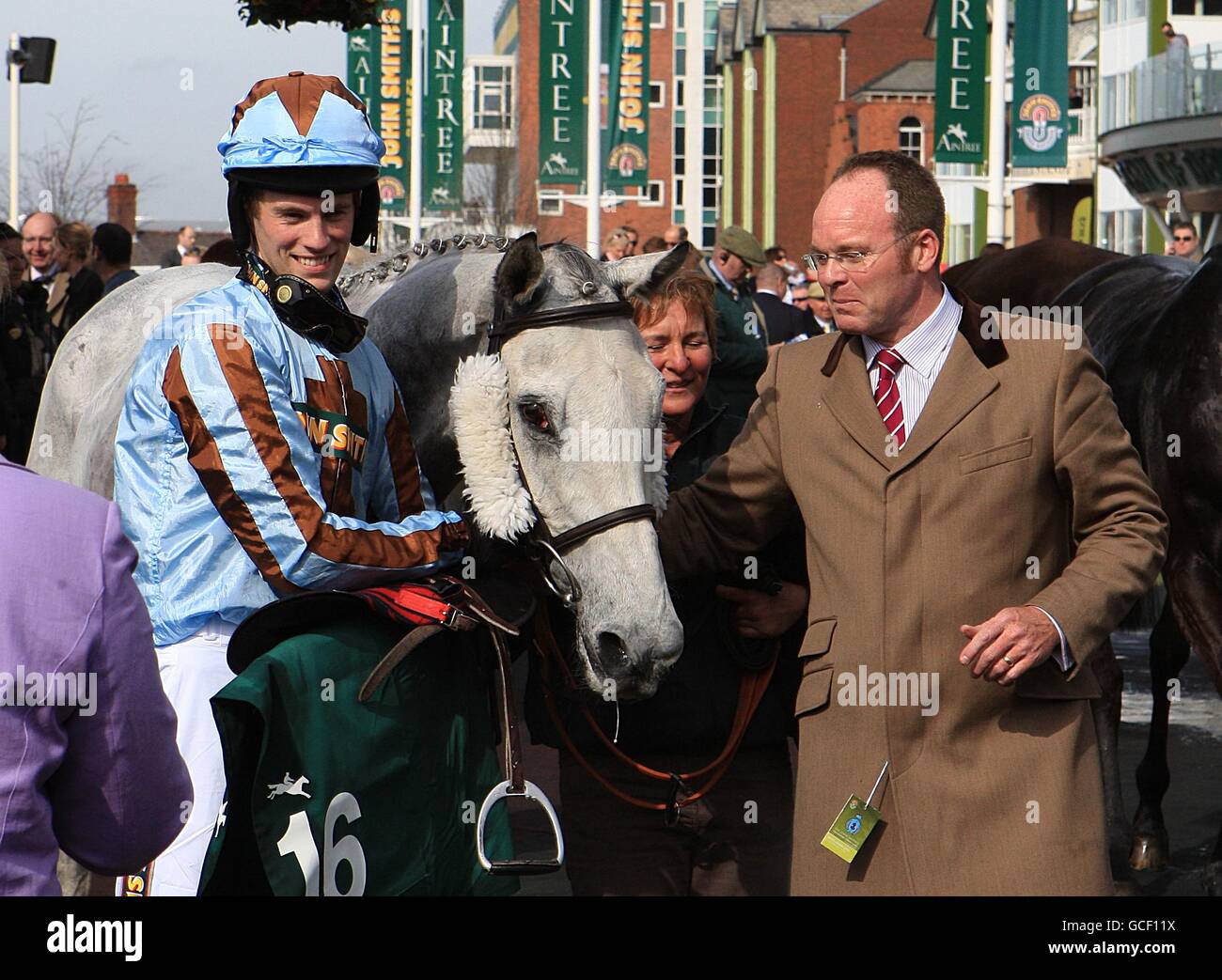 Trainer Richard Newland (right) and jockey Tom Weston (left) celebrate ...
