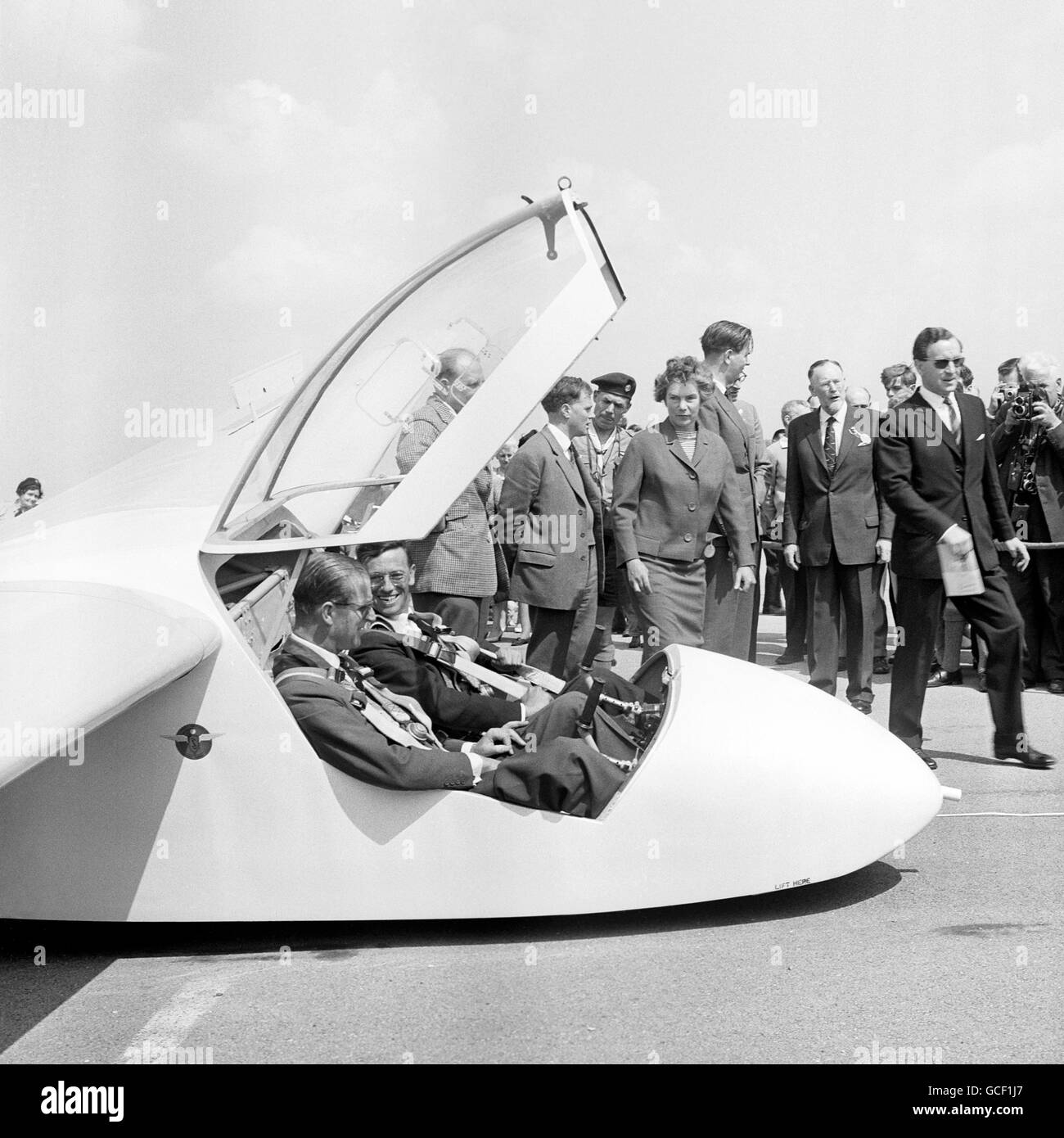 Prince Philip, Duke of Edinburgh, sitting at the controls of one of the ...