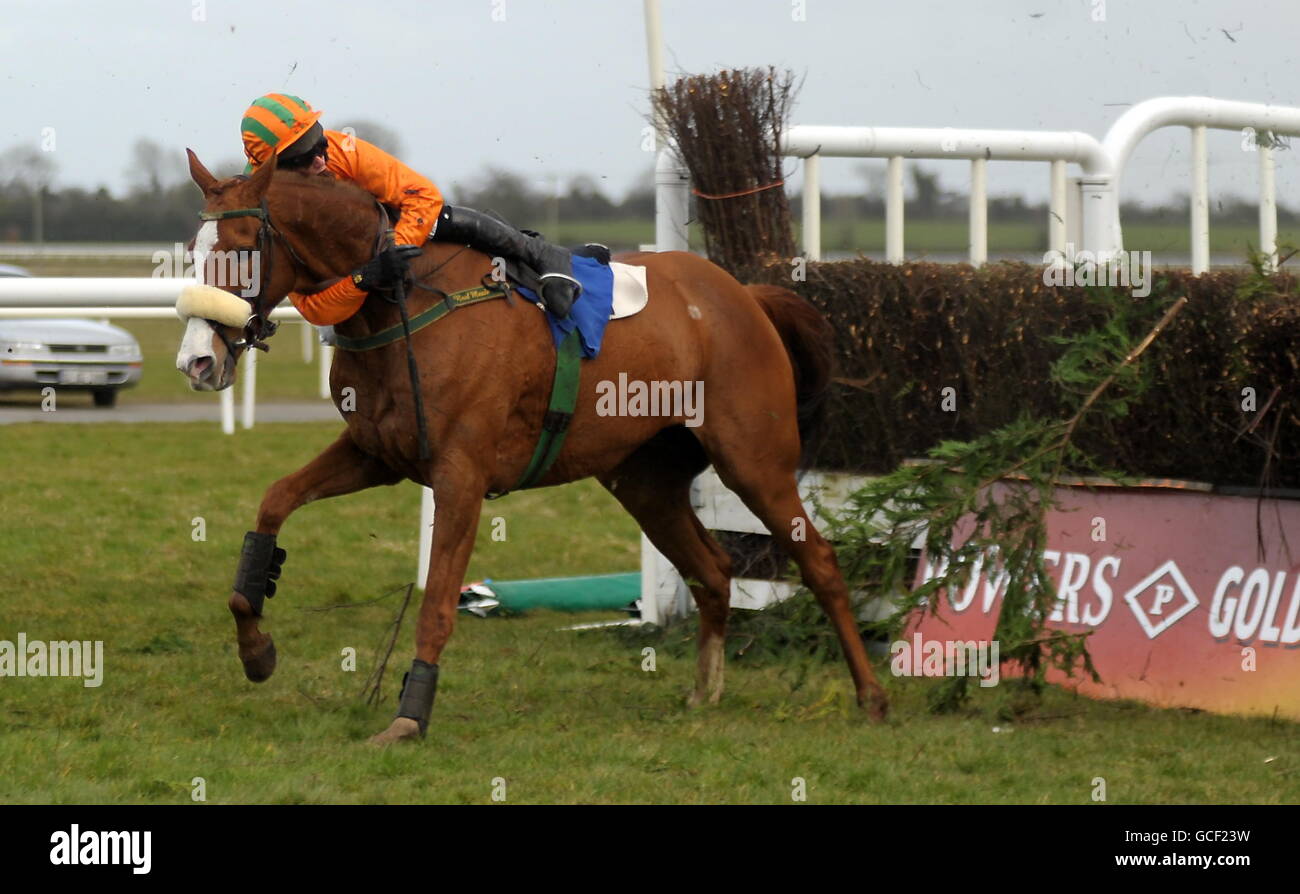 Jockey Paul Carberry manages to stay on Fisher Bridge after jumping the ...