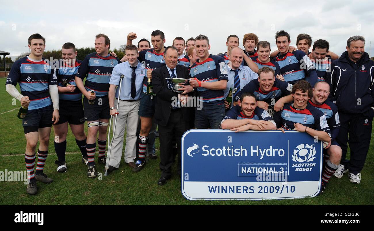 Archie Ferguson from the SRU presents the trophy to Allan Glen's Barry ...