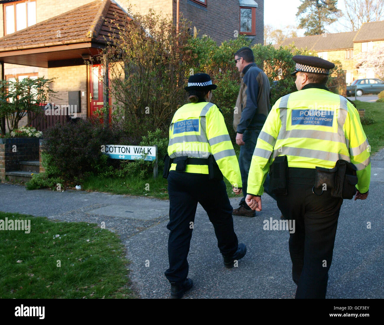 Police officers visit homes near a property in Broadfield, Crawley ...