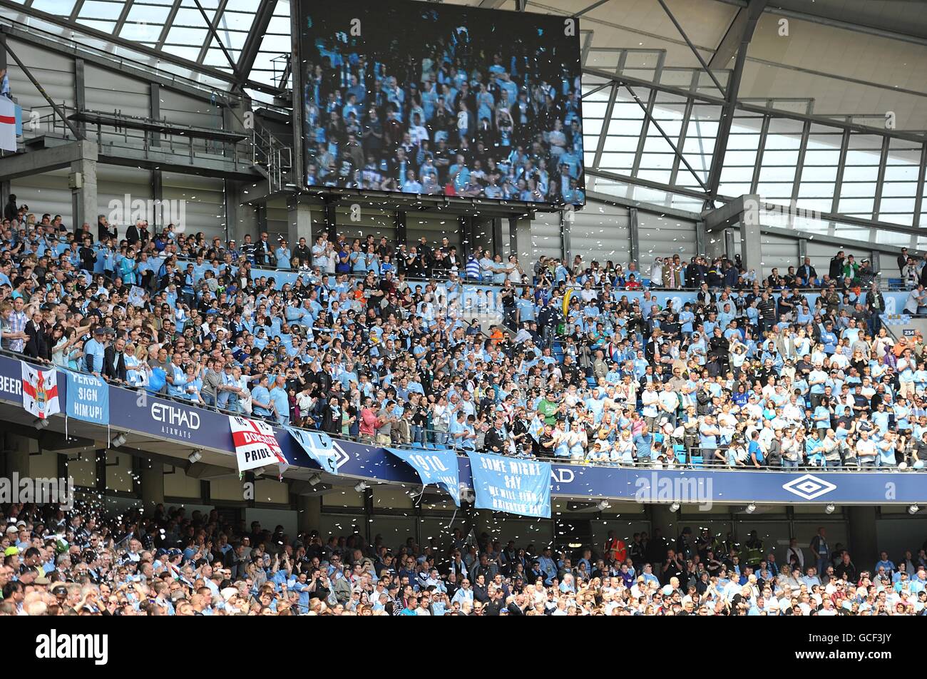 Manchester united fans cheer on their side in the stands hi-res stock ...