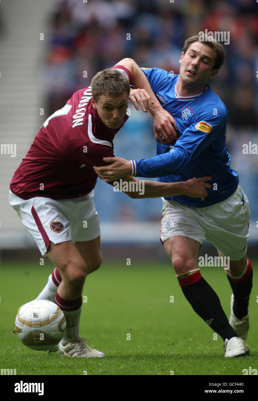 Rangers' Kevin Thomson and Hearts' Eggert Jonsson (left) battle for the ...