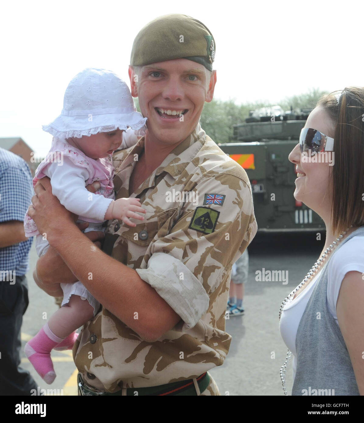 Private James Holland is reunited with his partner Nicola Ivory and ...