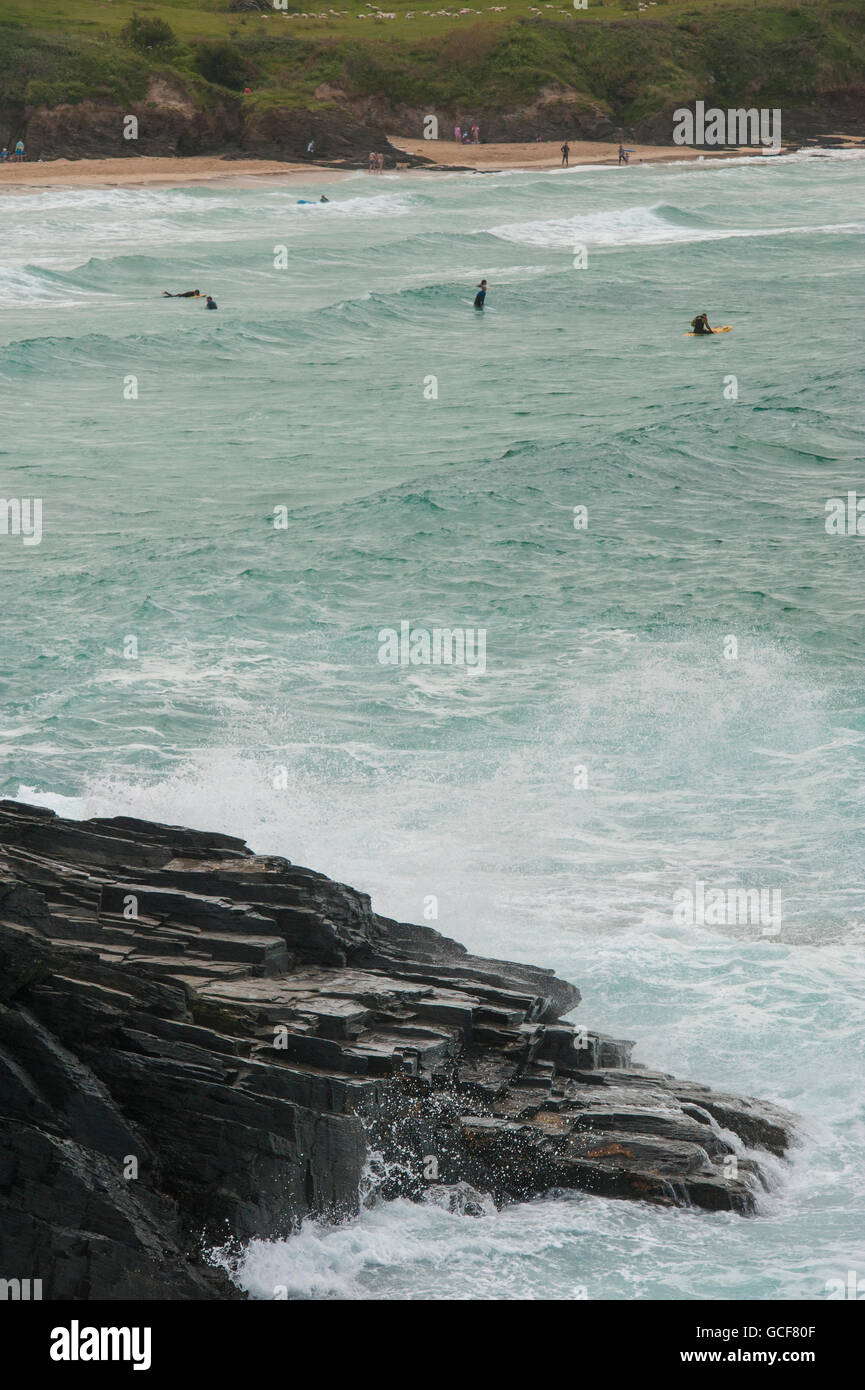 Surfing on Harwyn beach in Cornwall Stock Photo - Alamy