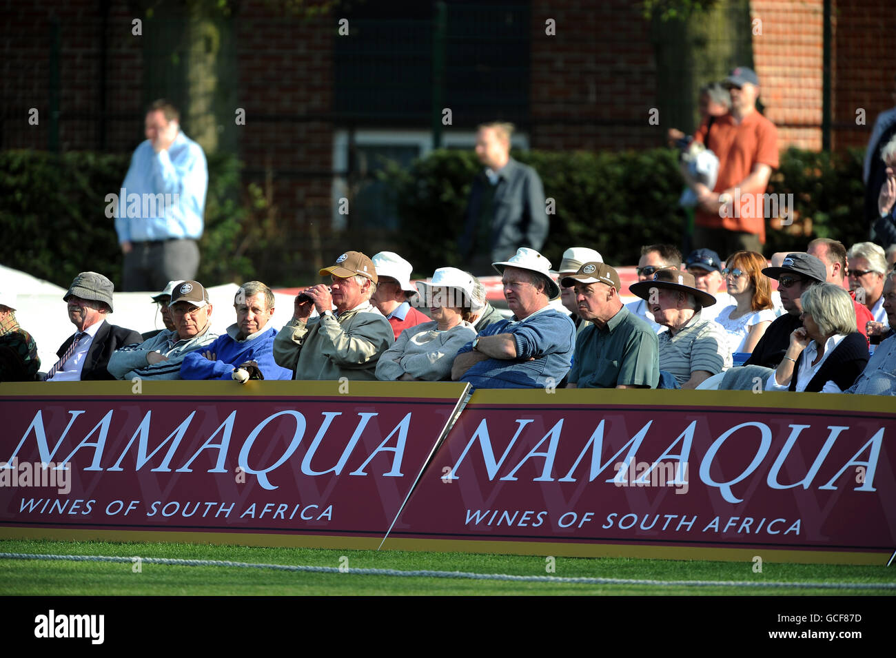 Spectators watch action boundary hi-res stock photography and images ...
