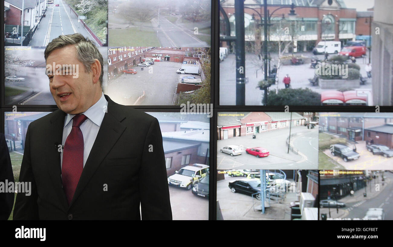 Gordon Brown talks to Police officers as they monitor screens of CCTV ...