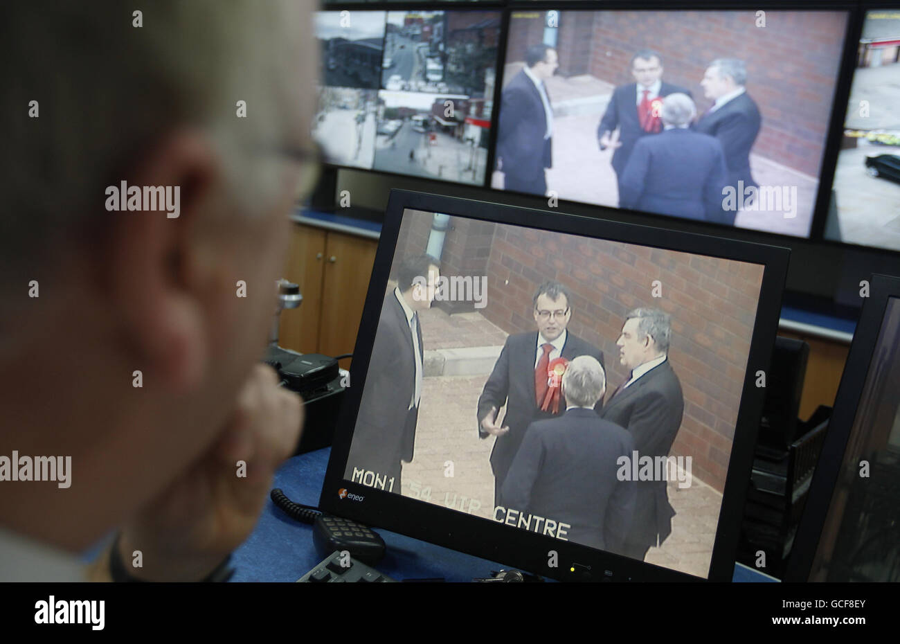 Police officers monitor the Prime Minister Gordon Brown on CCTV cameras ...